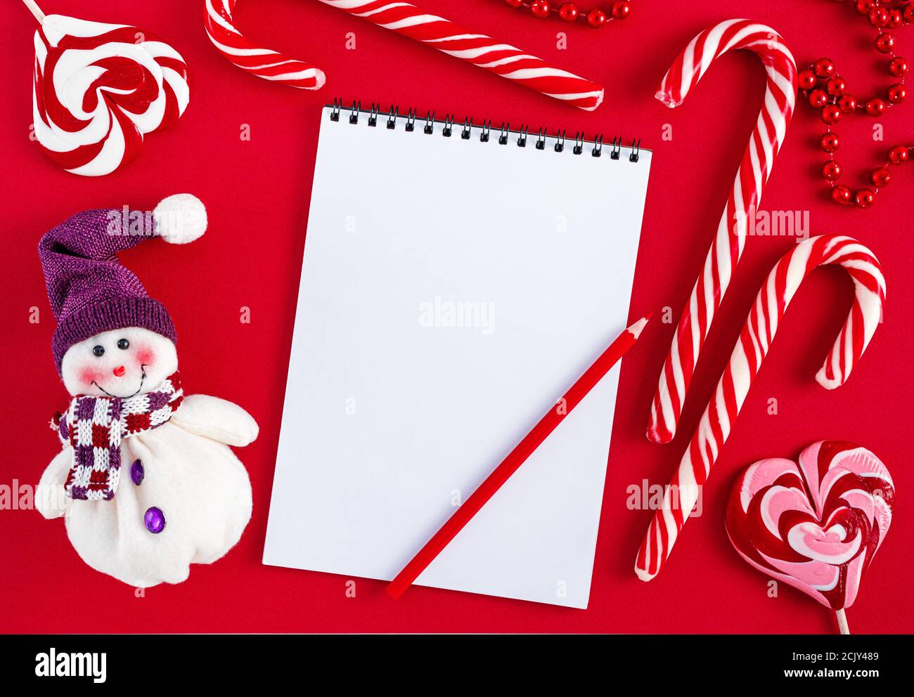 Empty Christmas wish list blank with candies and snowman on red ...