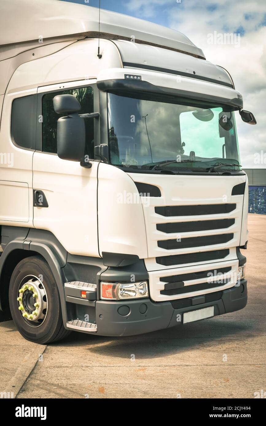Close up for cab of a lorry with a view of big tyre in sunny day Stock ...