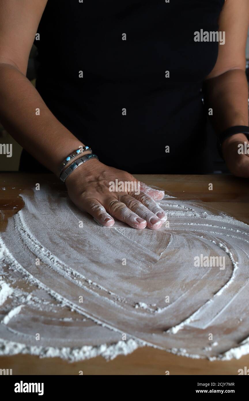 Homemade baking concept. Female hands sprinkle flour on the table Stock ...