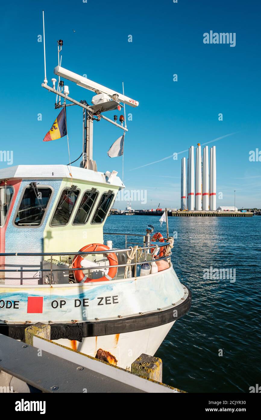 Passenger ferry in the port of Ostend with in the background mighty ...