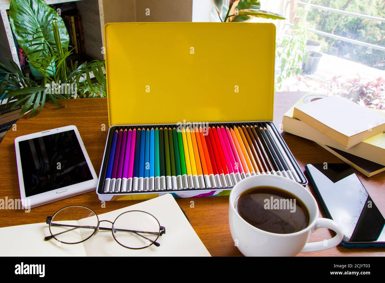 Drawing and painting table, sketching pencils and sketchbook, empty ...
