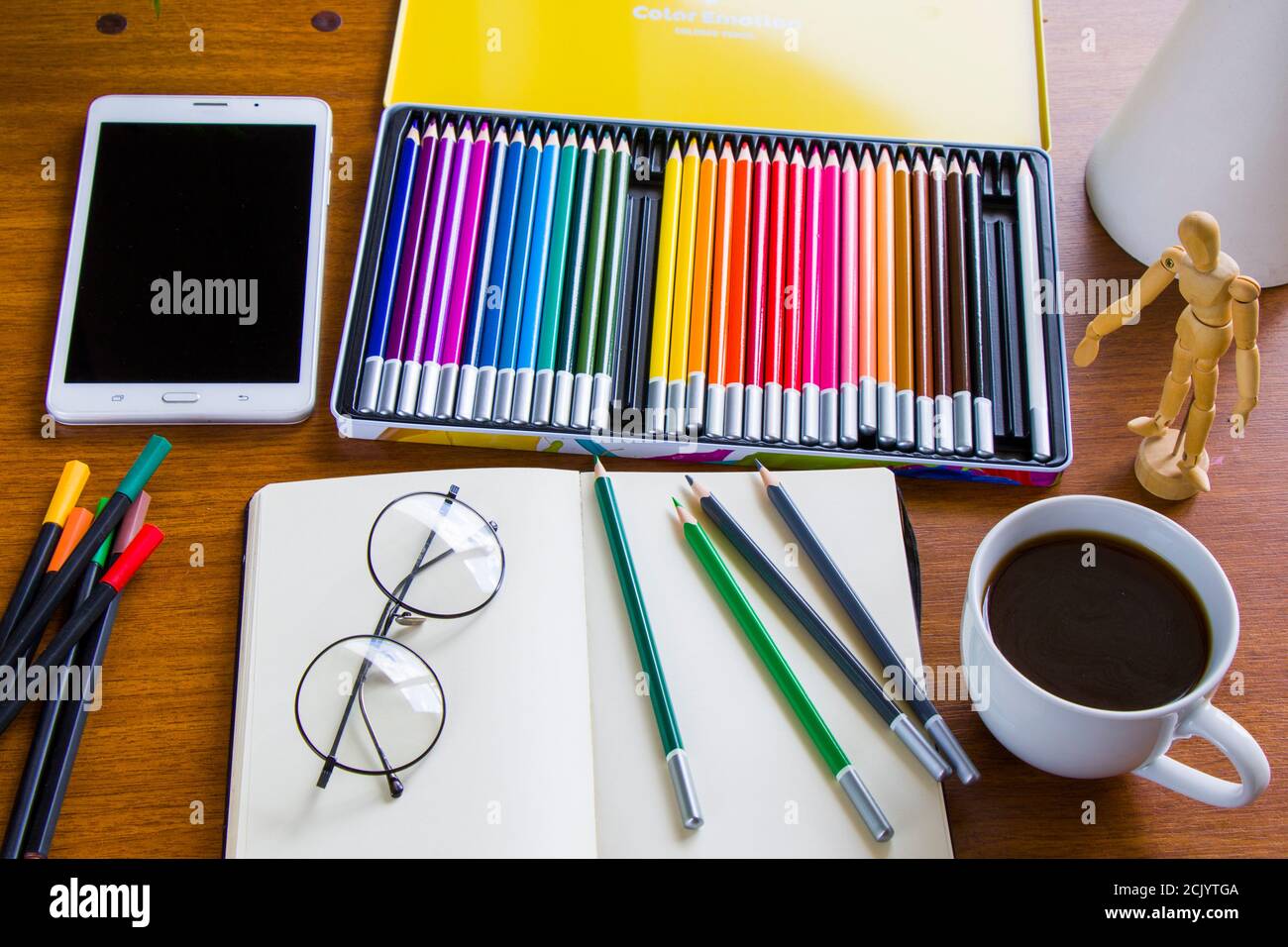 Drawing and painting table, sketching pencils and sketchbook, empty ...