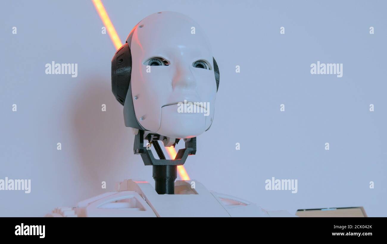 White humanoid robot head at technology exhibition. Future and robotic ...