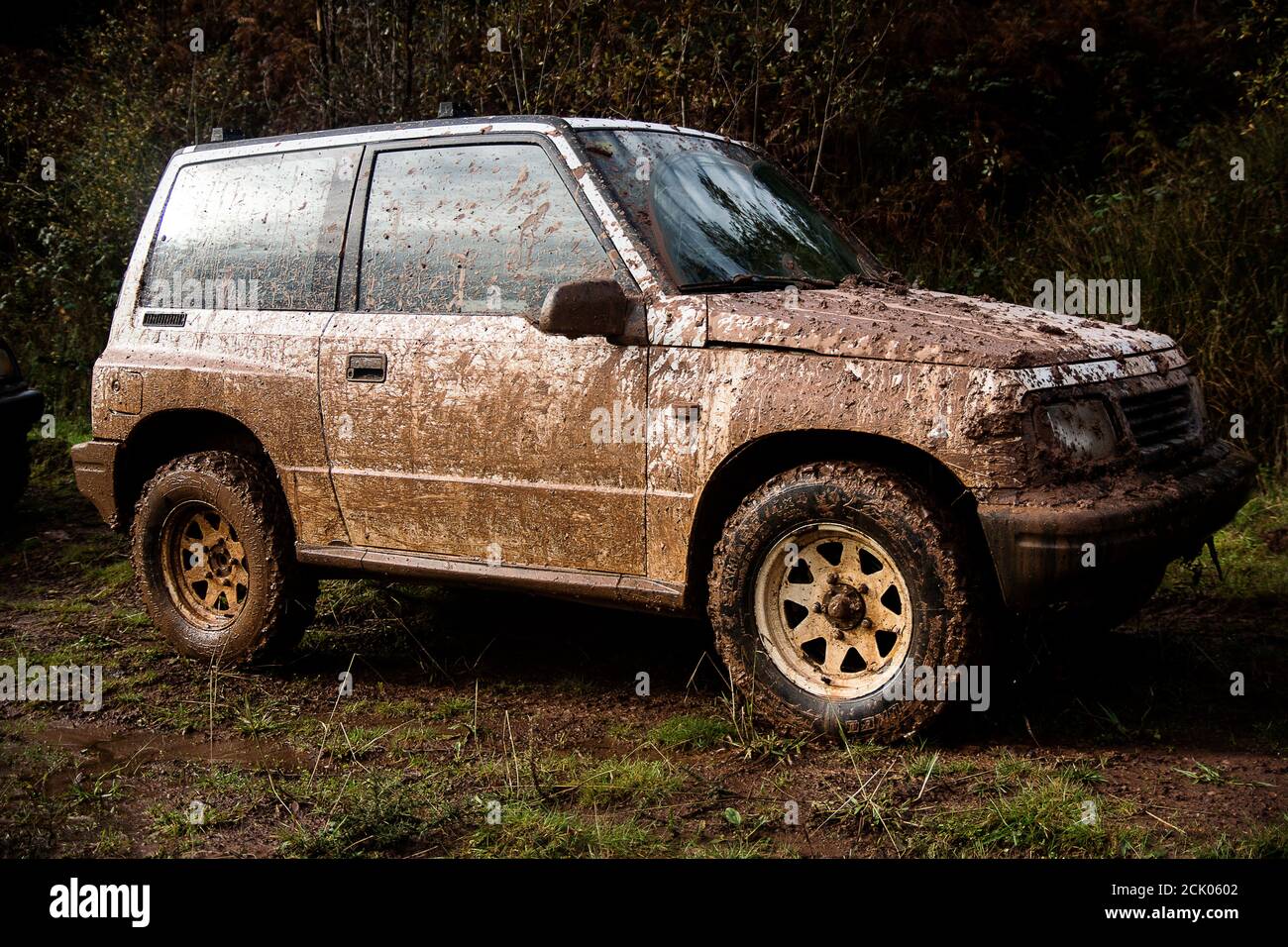 Off road cars full of mud on a mountain road Stock Photo - Alamy