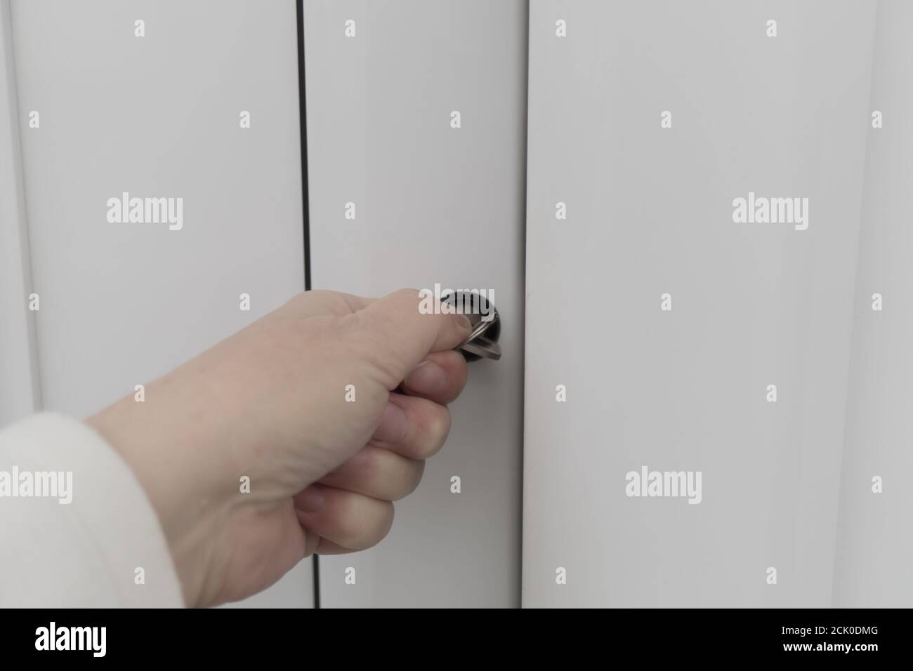 Person opening the front door with a key Stock Photo - Alamy