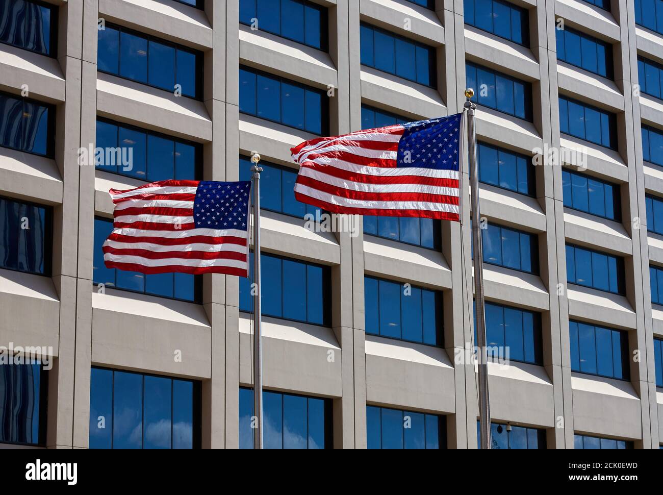 Two American Flags fly in the breeze in front of a building in Lower ...