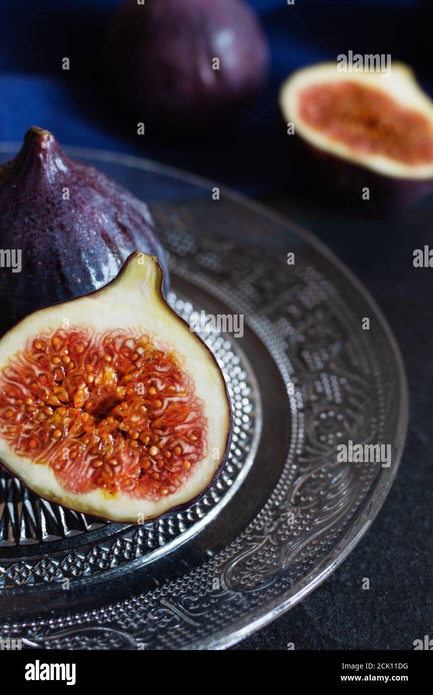 Fresh ripe figs on black background. Healthy tropical fig fruit Stock ...