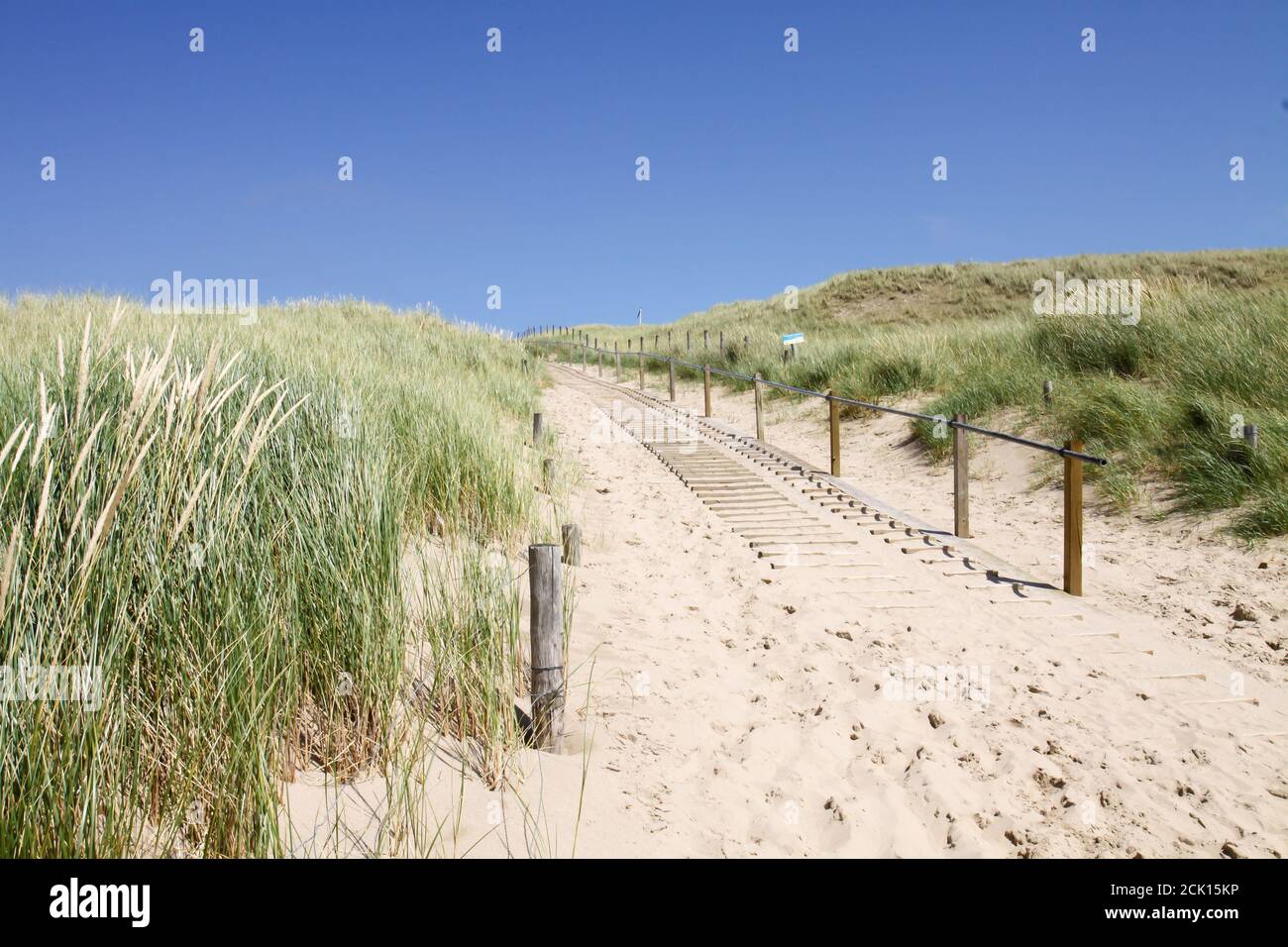 Set of stairs partially covered with sand leading to the beach Stock ...