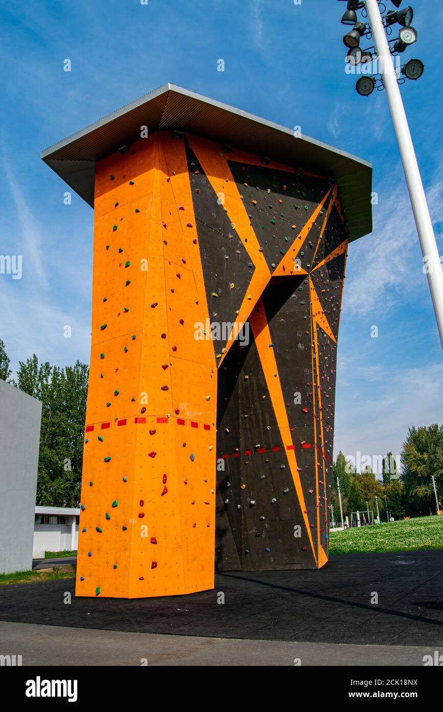 Artificial outdoor climbing wall with plastic rocks in city of Braga ...
