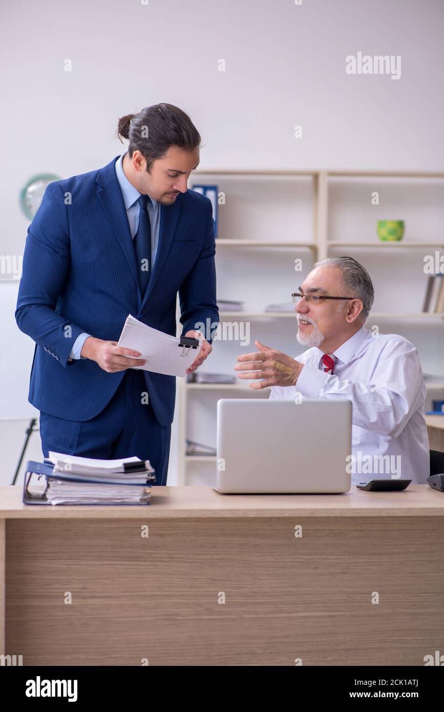 Two employees in the office environment Stock Photo - Alamy