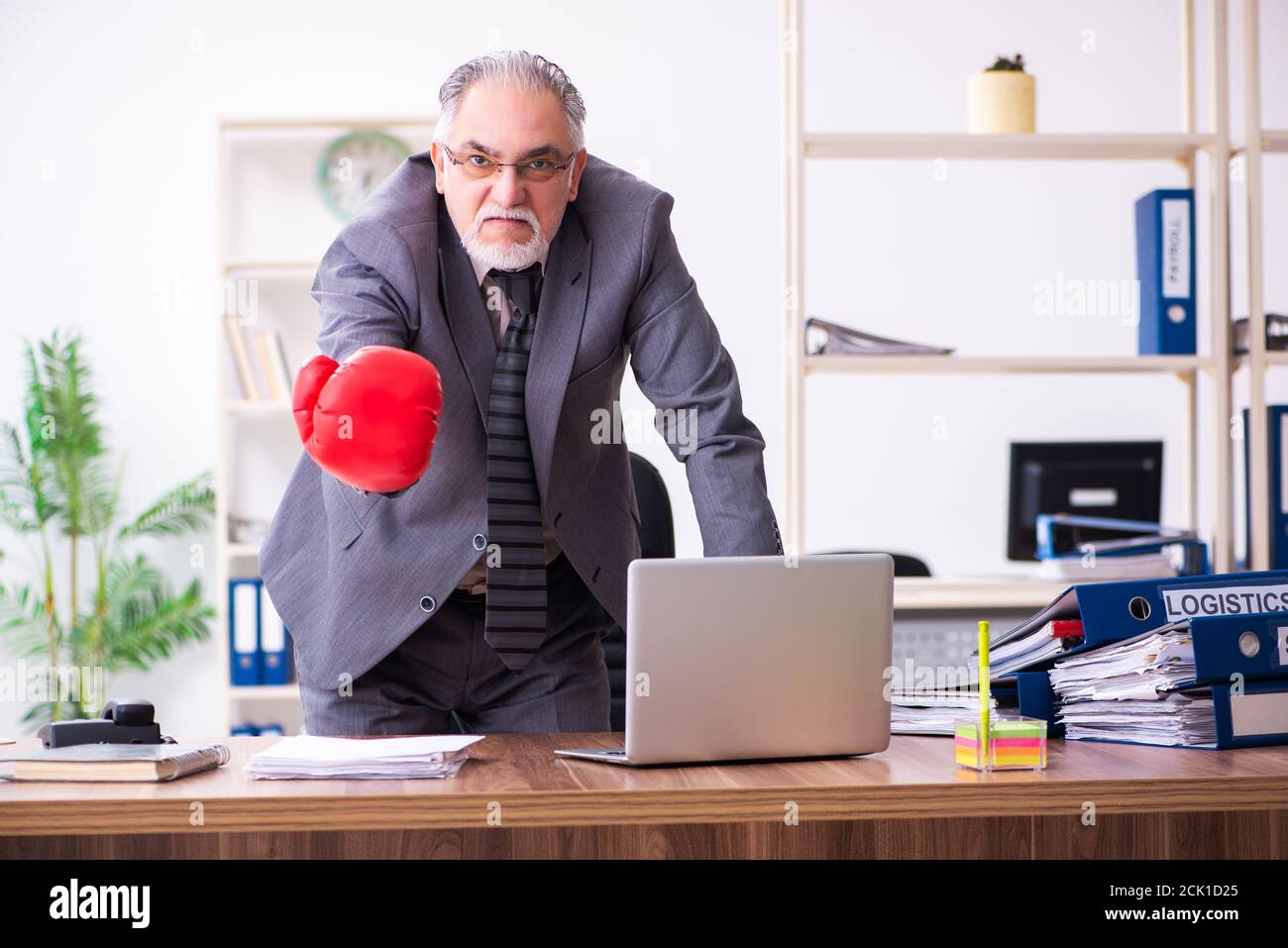 Businessman angry and furious at his workplace Stock Photo - Alamy