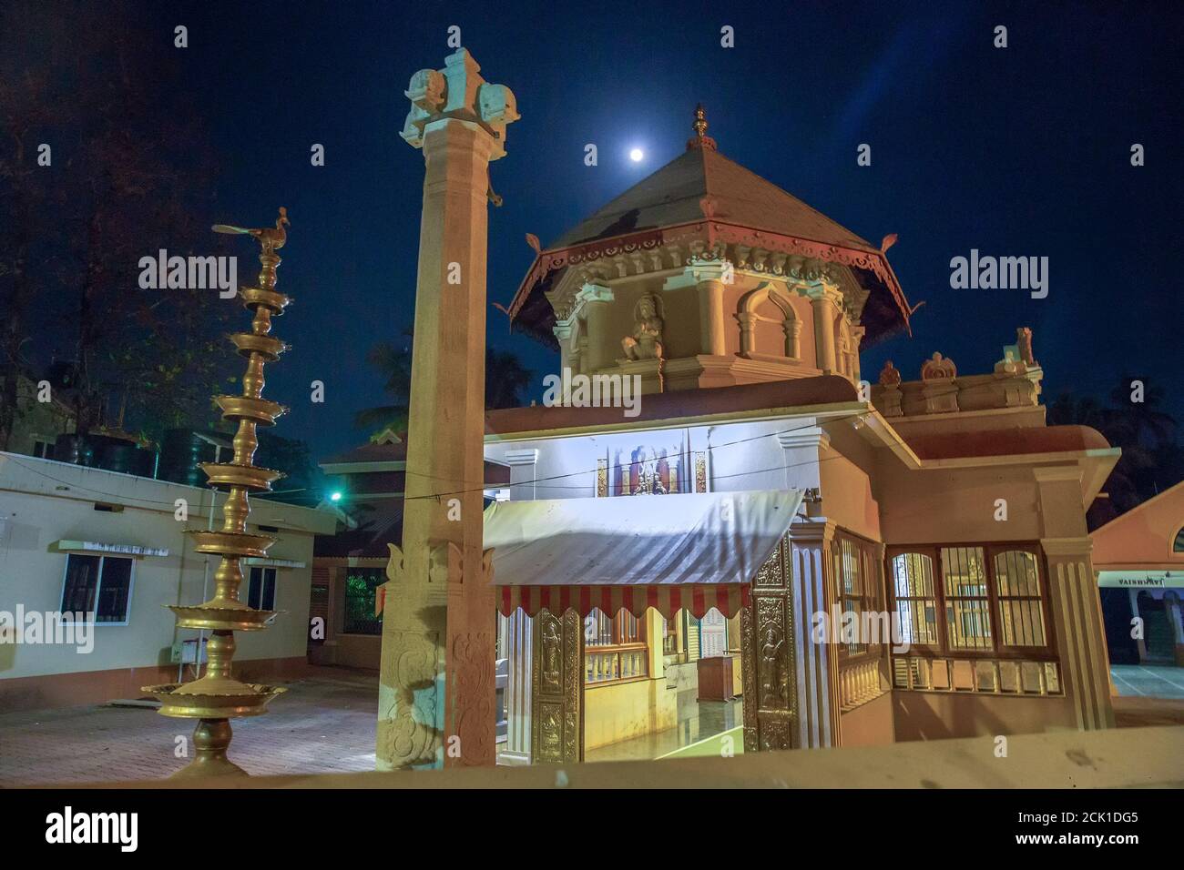 Yellow temple of Hinduism . Moon in night blue sky Stock Photo - Alamy