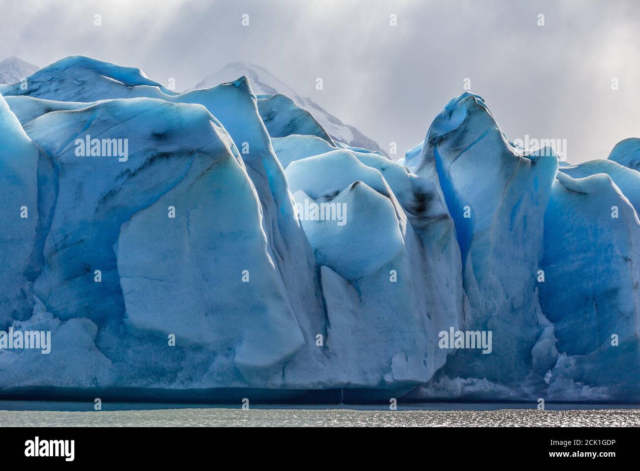Melting glacier blue ice field Stock Photo - Alamy