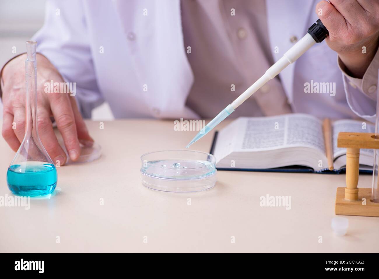 Experienced old scientist working in the laboratory Stock Photo - Alamy