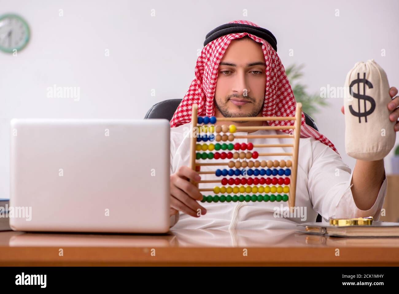 Male arab employee working in the office Stock Photo - Alamy