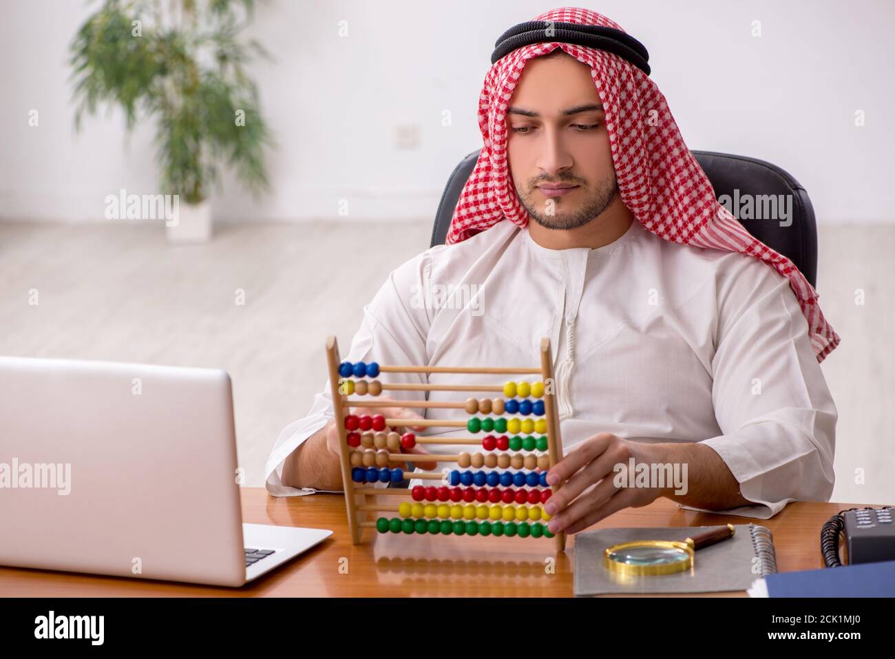 Male arab employee working in the office Stock Photo - Alamy