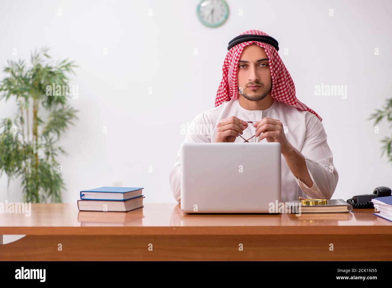Male arab employee working in the office Stock Photo - Alamy