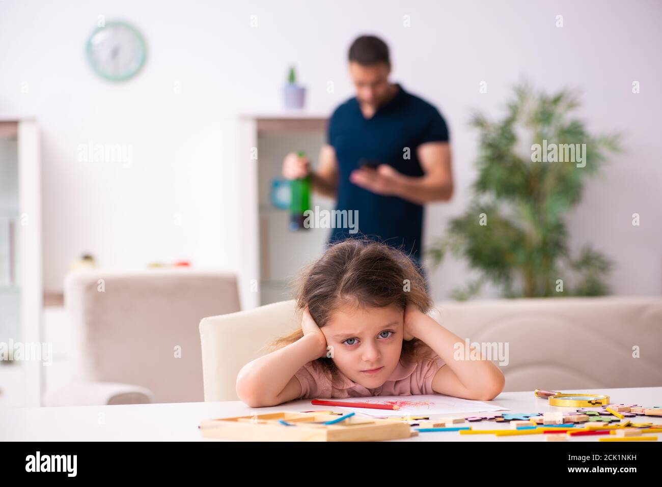 Drunk father and little girl at home Stock Photo - Alamy