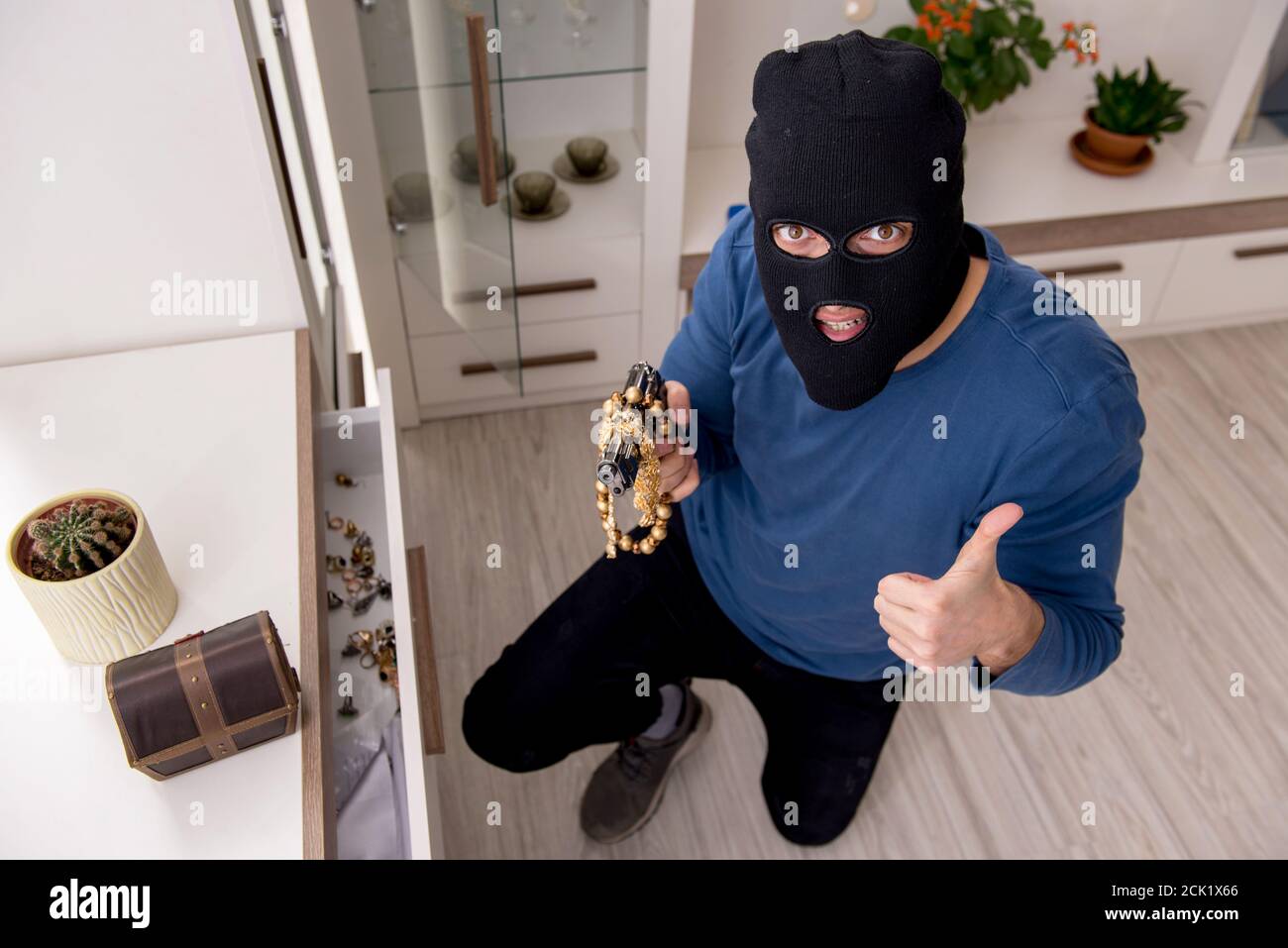 Camera view of robber stealing valuable things from the house Stock ...