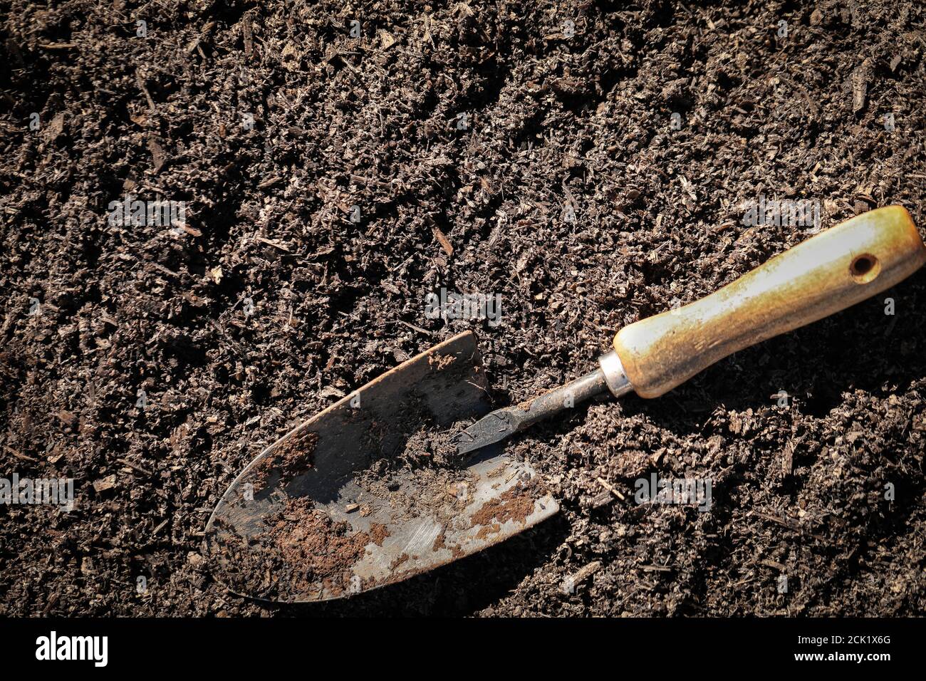 Dirty metal spade in the vegetable garden with empty soil Stock Photo ...