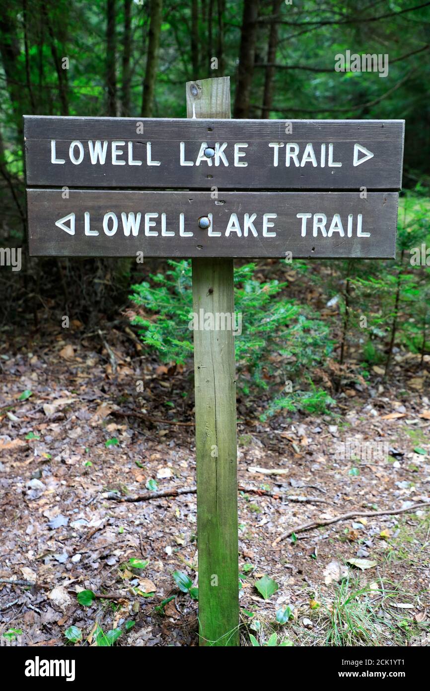 Wooden direction signs by the Lowell Lake Trail.Lowell Lake State Park ...