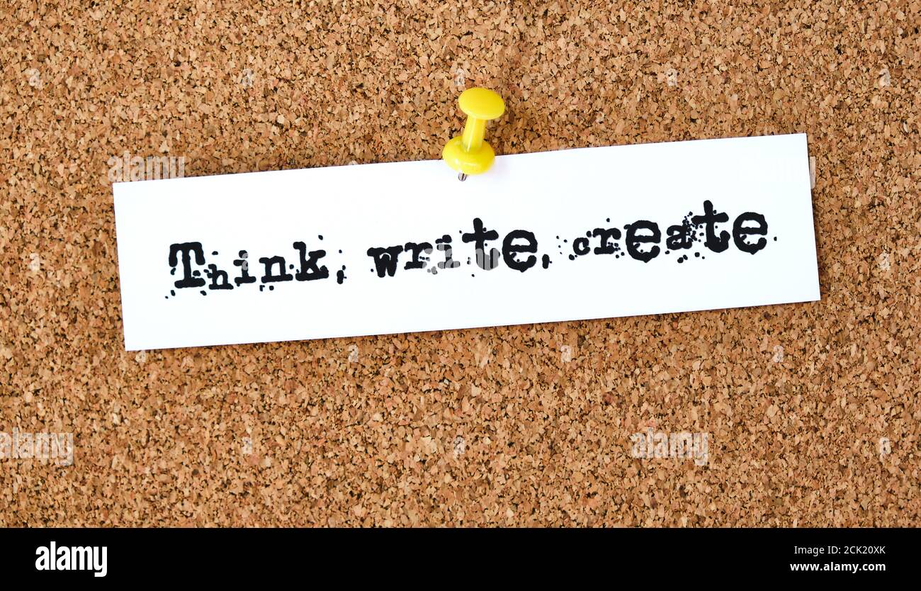 Think, write, create. Text written on a piece of paper or note, cork ...