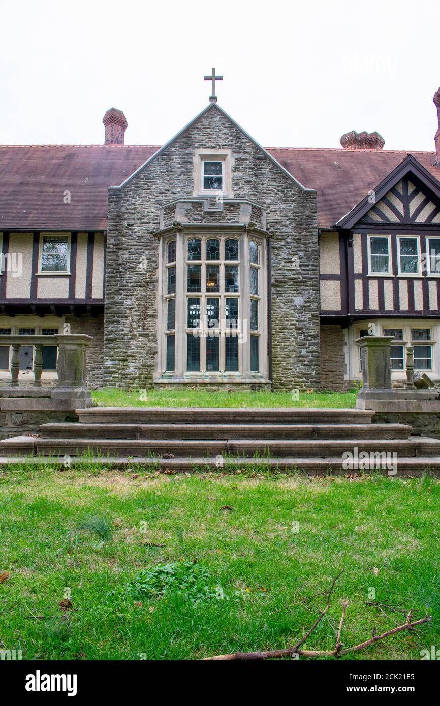A Detailed and Ornamental Cobblestone Building With a Red Roof Stock ...