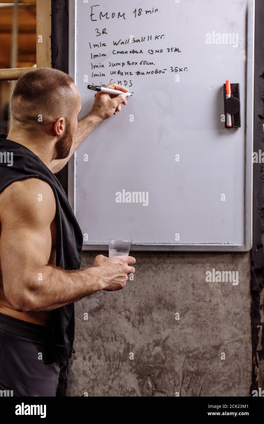 Male athlete writing down plan hi-res stock photography and images - Alamy