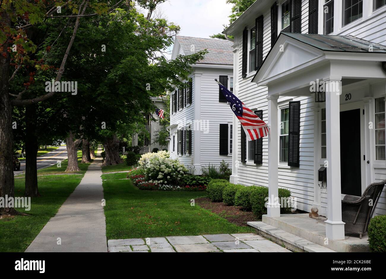 Colonial houses with American Revolution flag aka Bennington 76 flag in ...