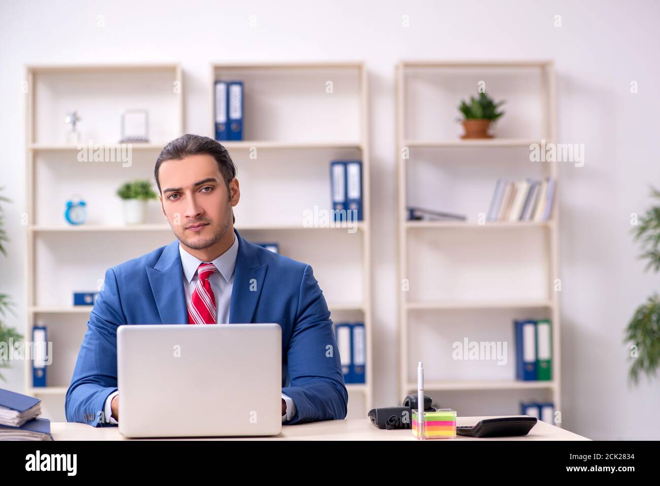 Funny employee clown working in the office room Stock Photo - Alamy