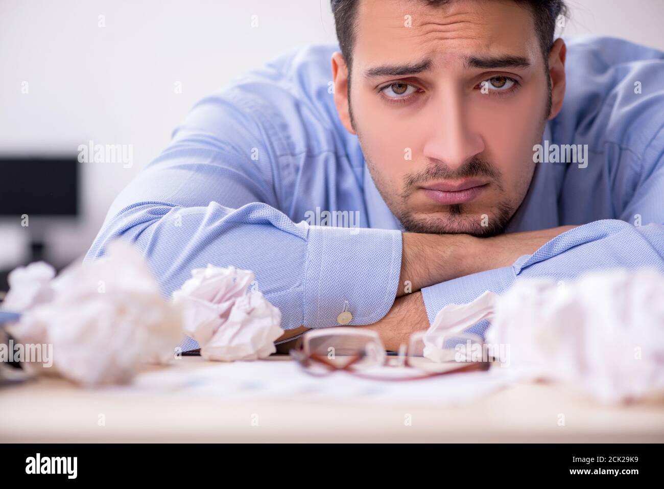 Sick male employee suffering at the workplace Stock Photo - Alamy