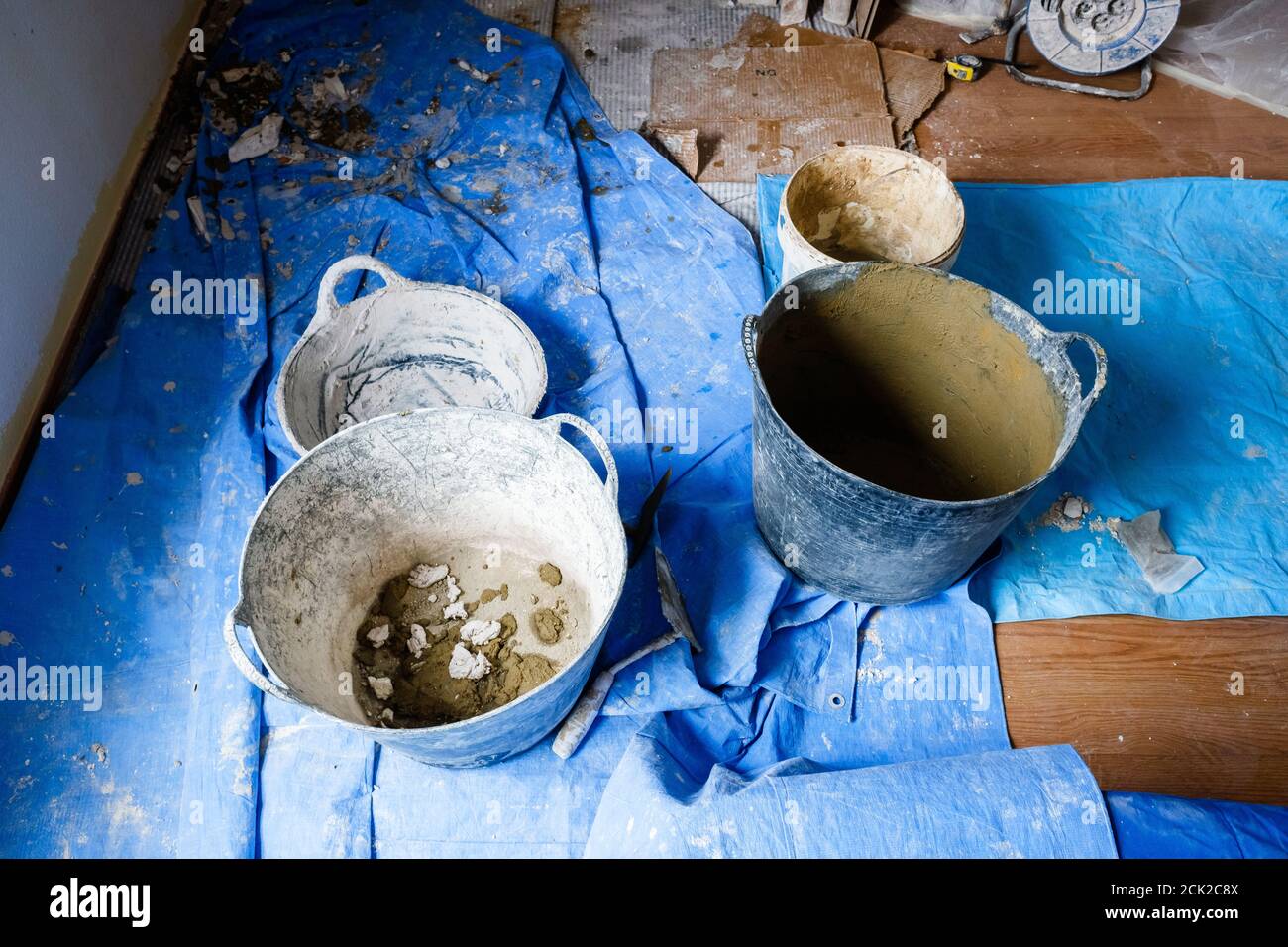 Dirty buckets and used with cement by bricklayers during a botched ...