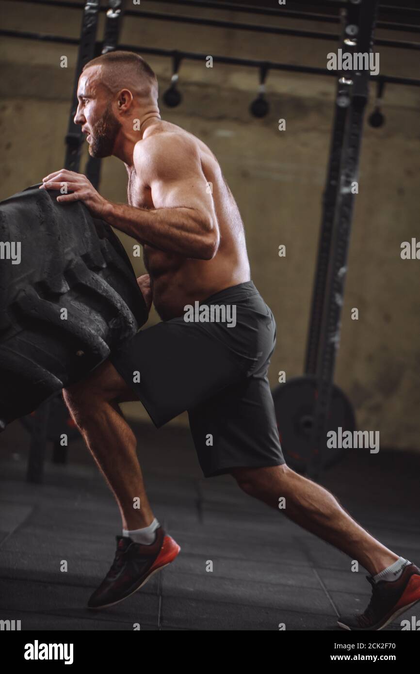 sportman is good at cross fitting. well-built athlete is fond of ...