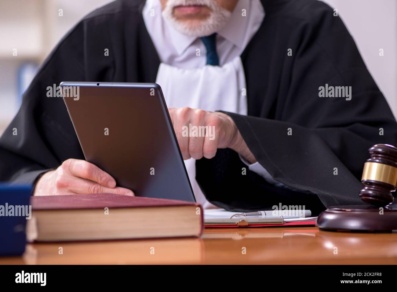 Old judge working in courthouse Stock Photo - Alamy