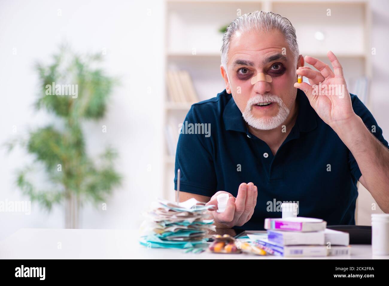 Old man in budget planning concept Stock Photo - Alamy