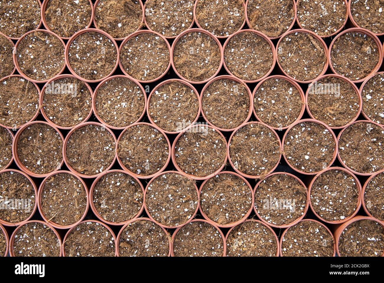 Background view of empty flower pots with soil inside Stock Photo - Alamy