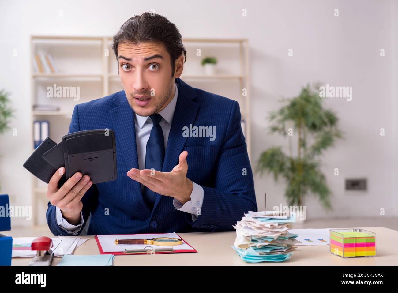 Young financial manager in the office Stock Photo - Alamy