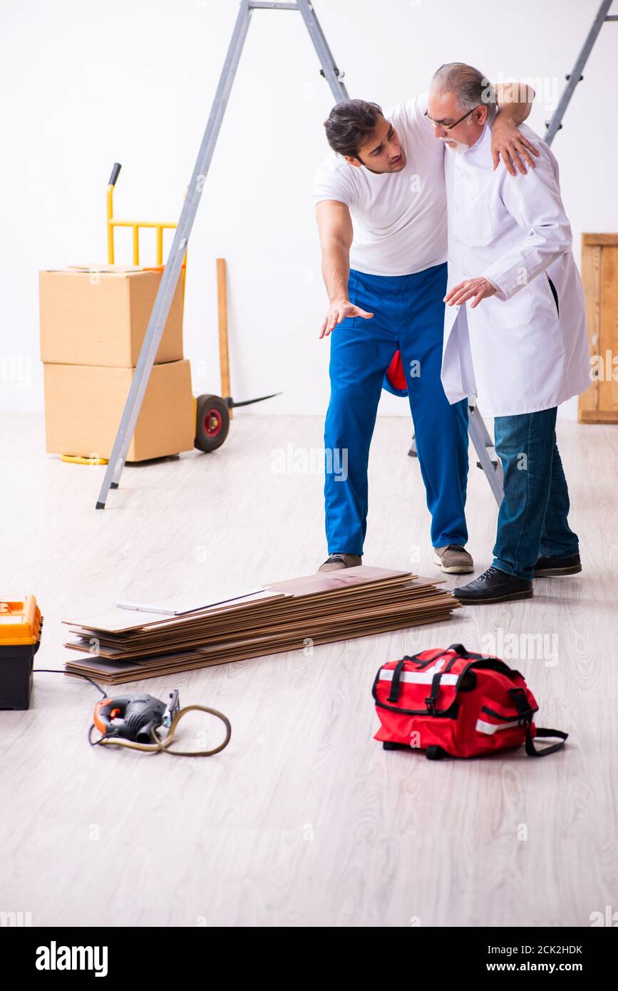 Experienced paramedic helping worker bitten by snake Stock Photo - Alamy