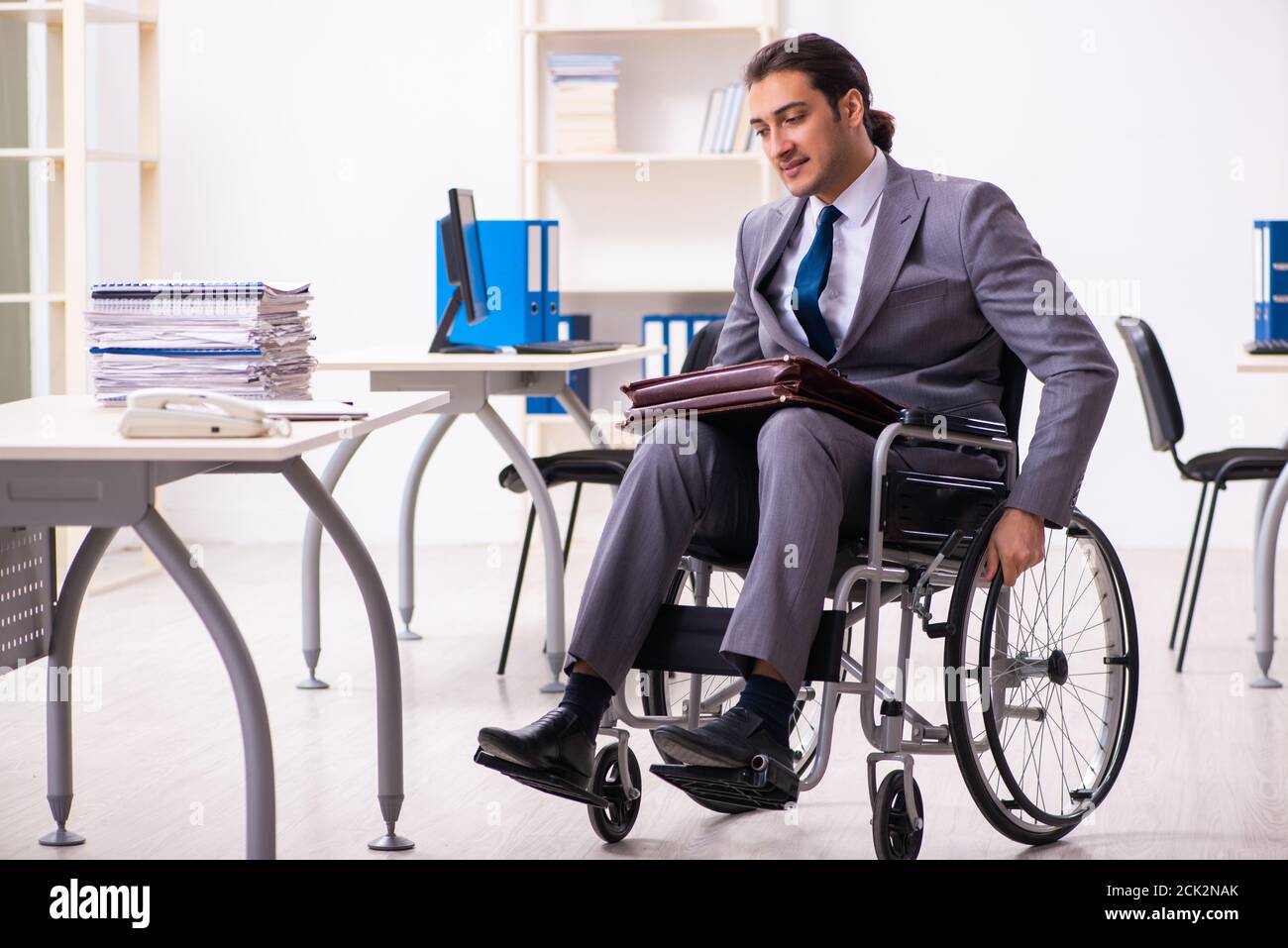 Disabled employee in the office environment Stock Photo - Alamy