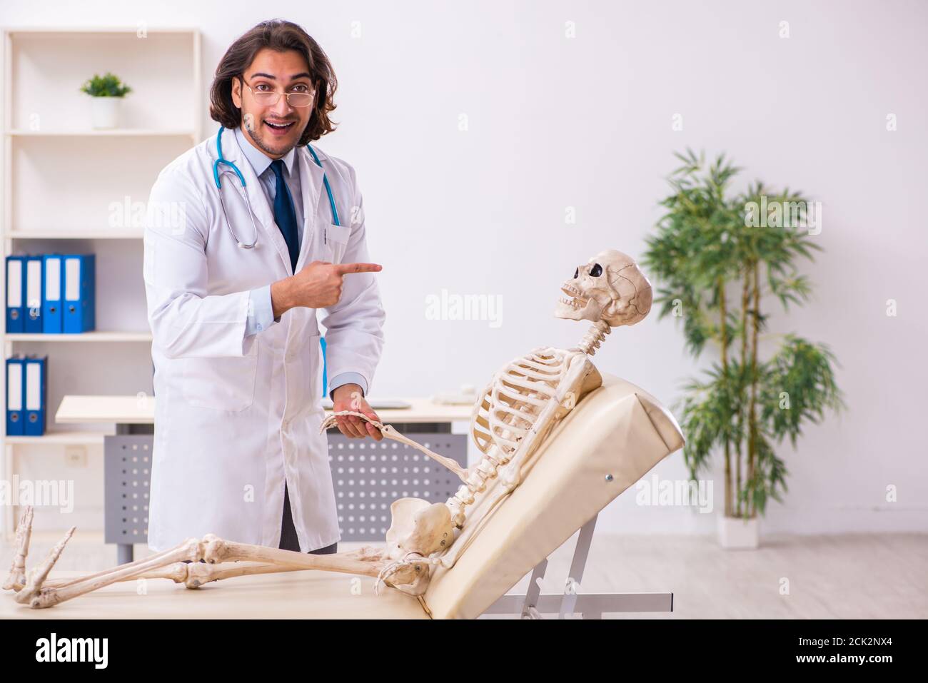 Crazy doctor examining the dead patient Stock Photo - Alamy