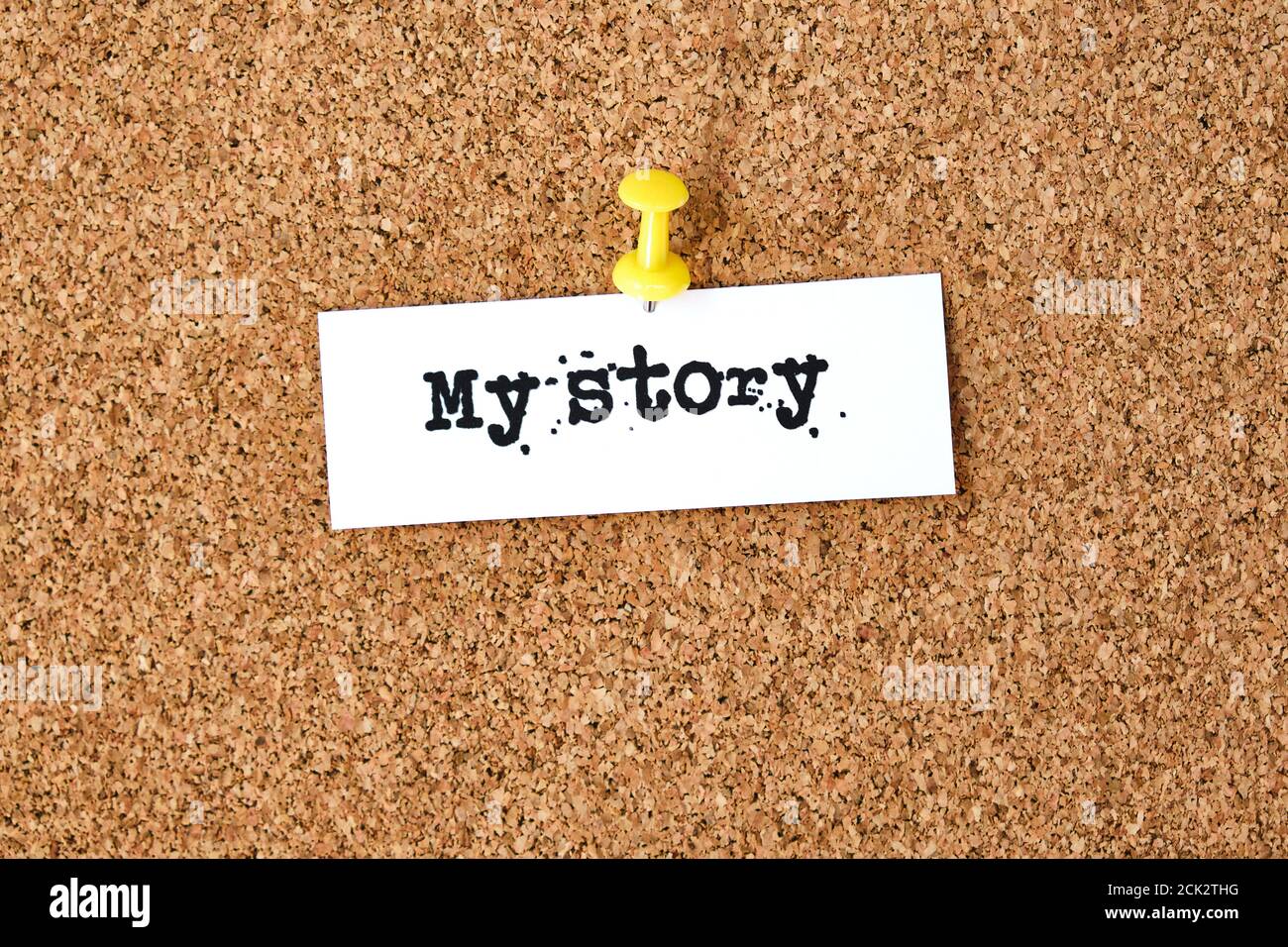My story. Text written on a piece of paper or note, cork board ...