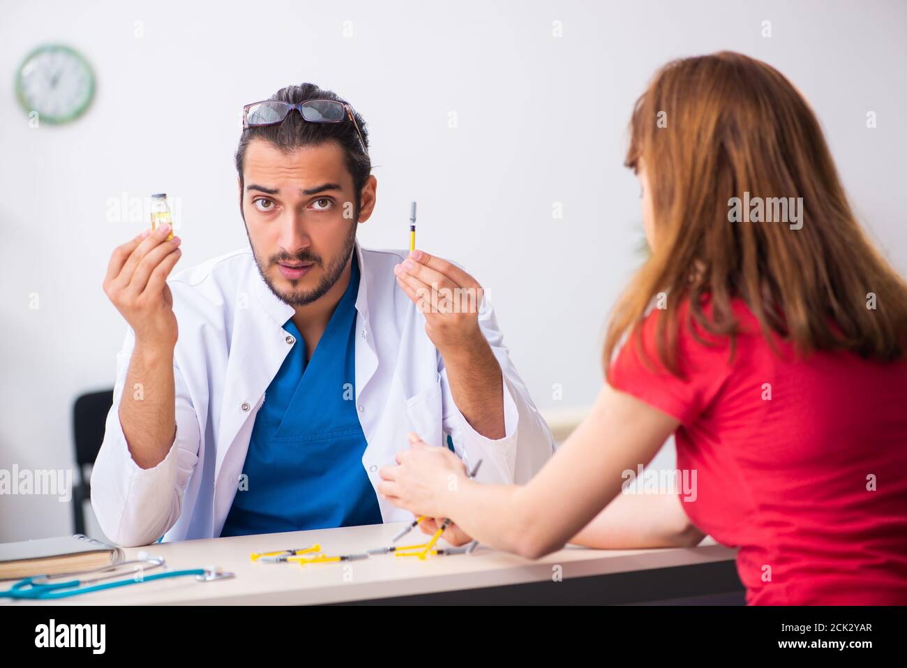 Female diabetic patient visiting young doctor Stock Photo - Alamy