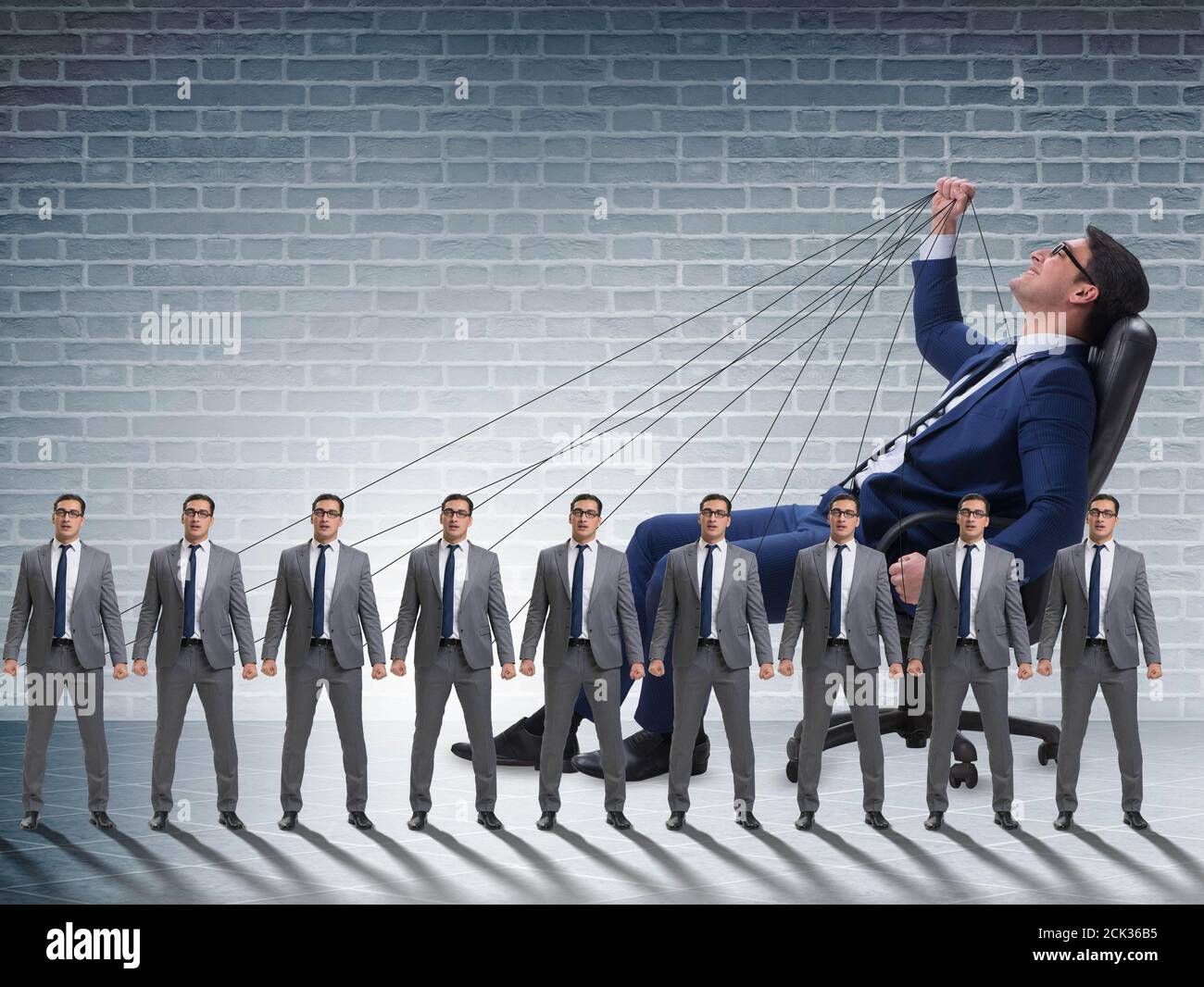 The boss employee manipulating his staff in business concept Stock ...