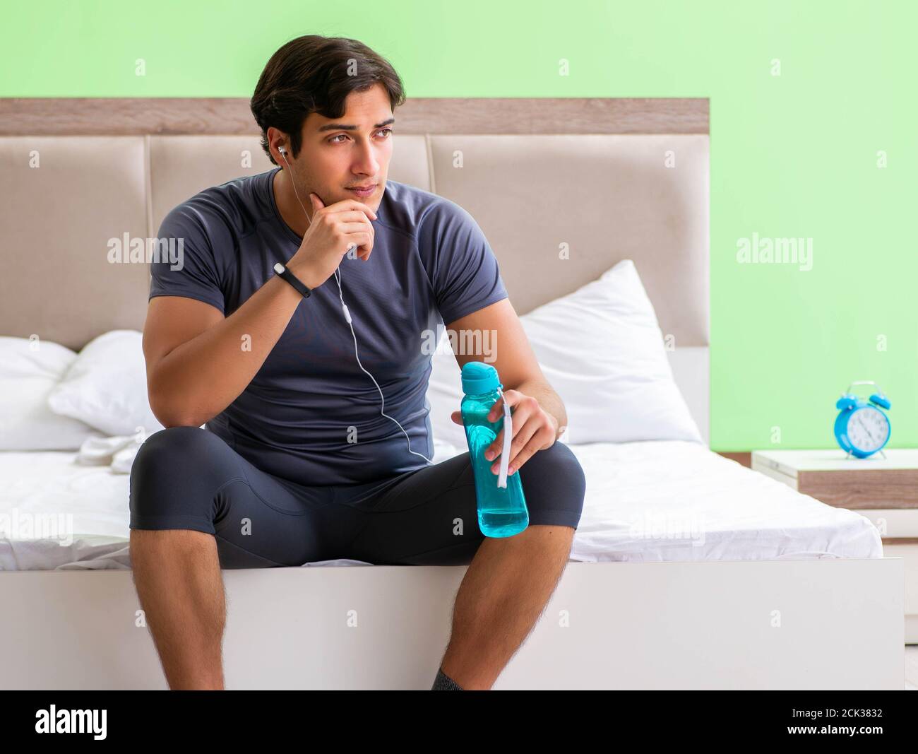 The young handsome man doing morning exercises in the hotel room Stock ...