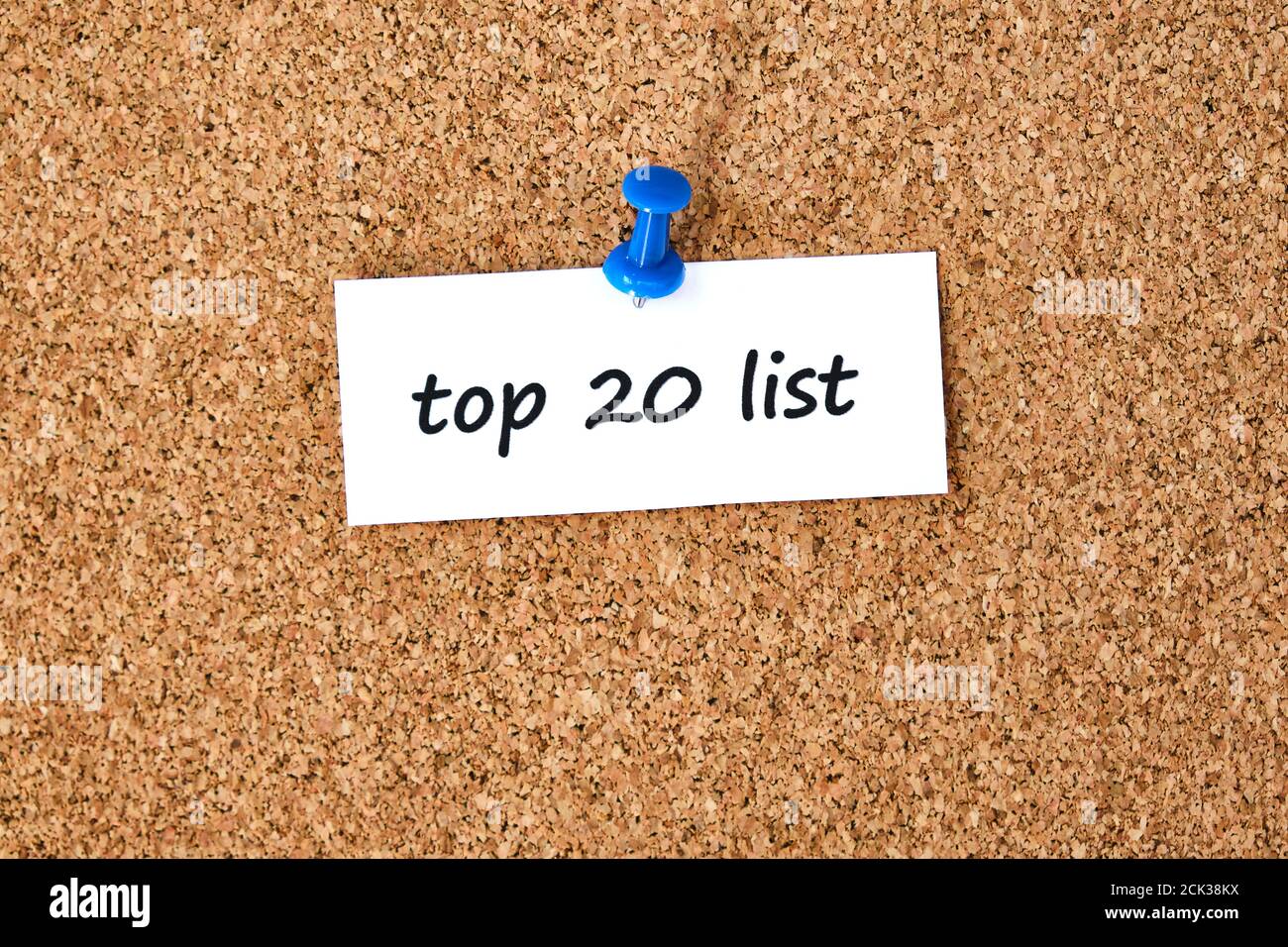 Top 20 list. Text written on a piece of paper or note, cork board ...