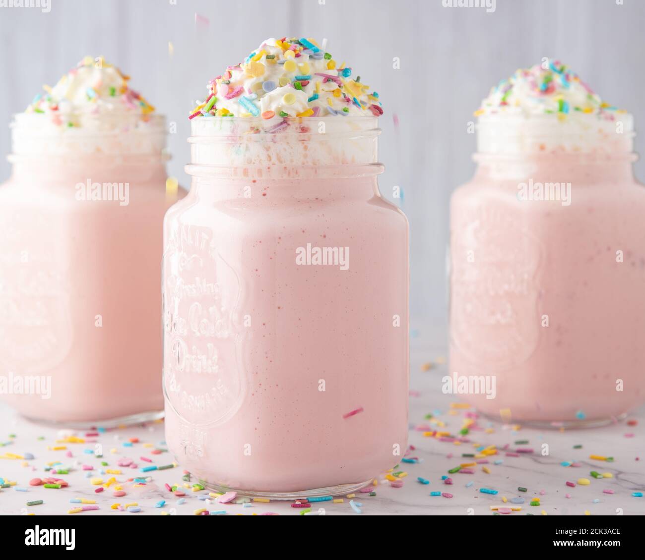 Jar of a strawberry refreshing drink with various sugar sprinkles Stock ...