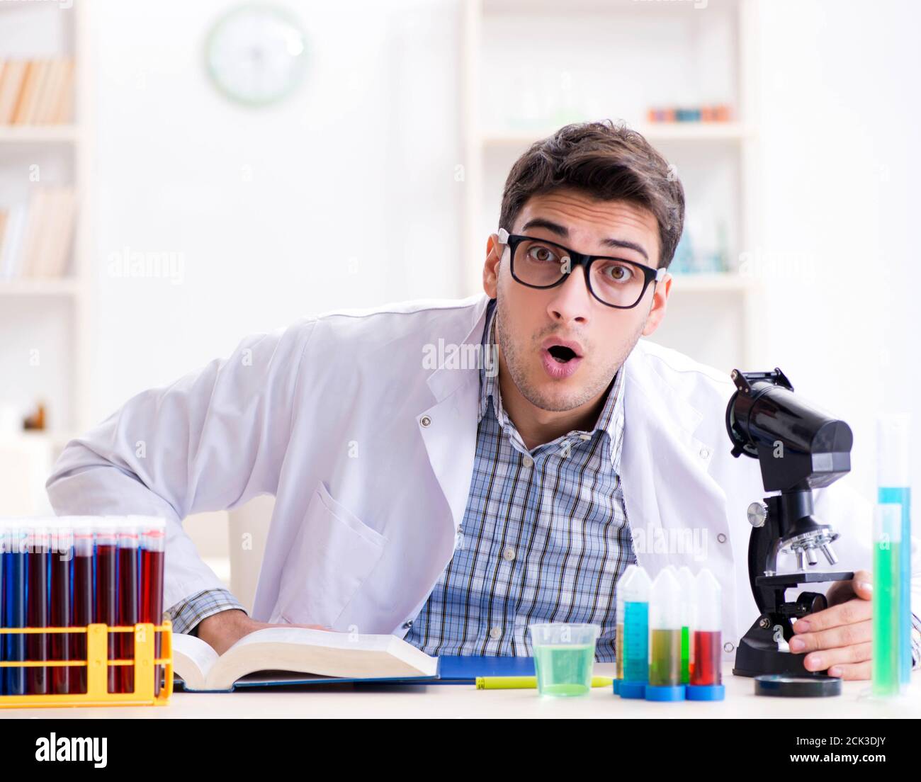 Chemistry student doing chemical experiments at classroom activity ...
