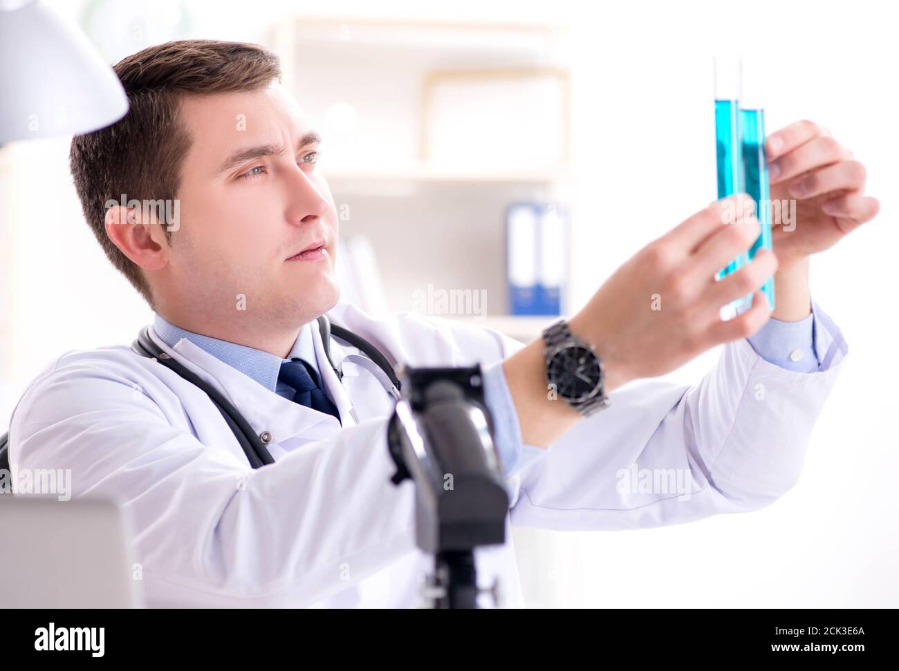 The male doctor looking at lab results in hospital Stock Photo - Alamy