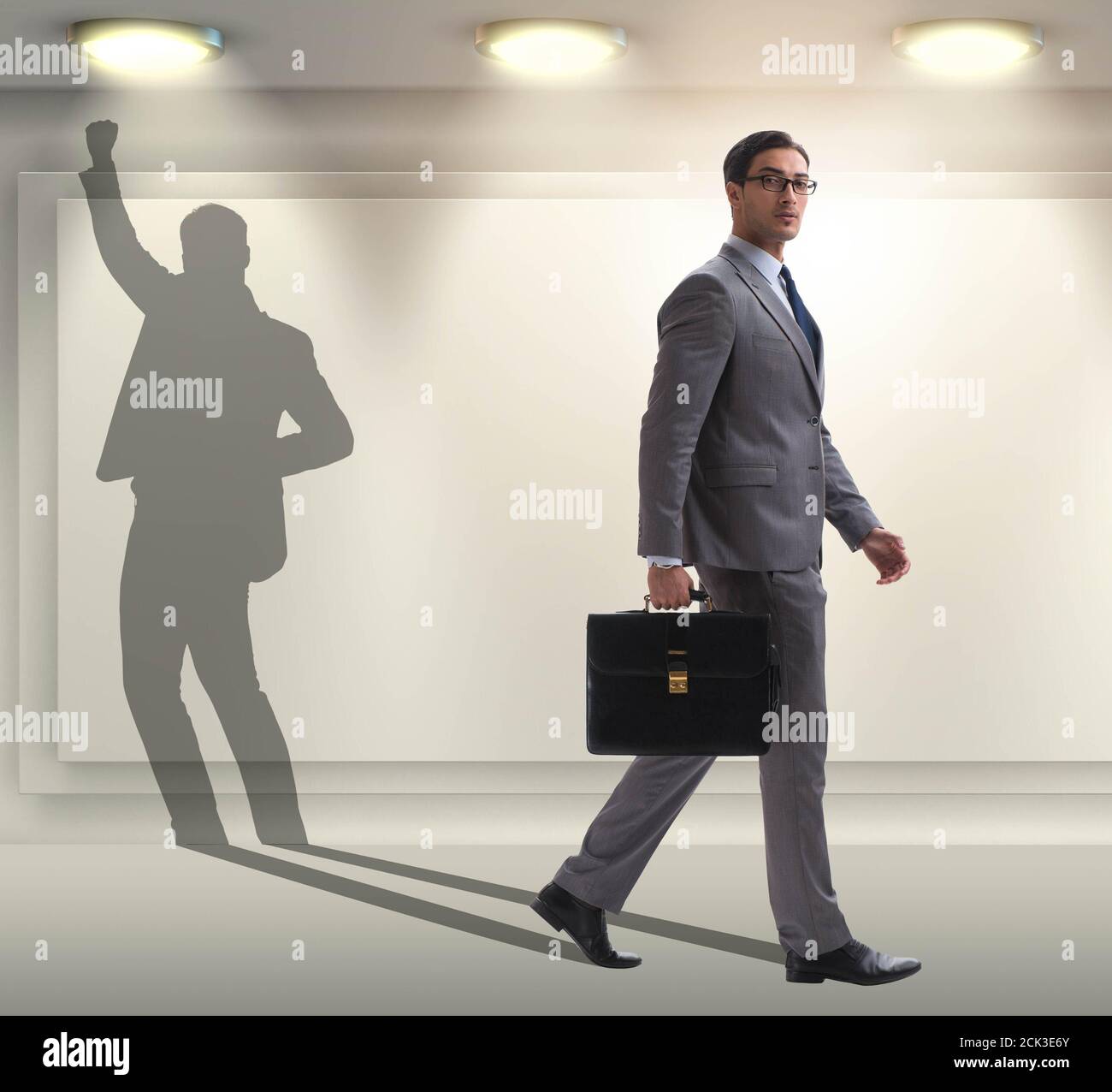 The businessman and his shadow in business concept Stock Photo - Alamy