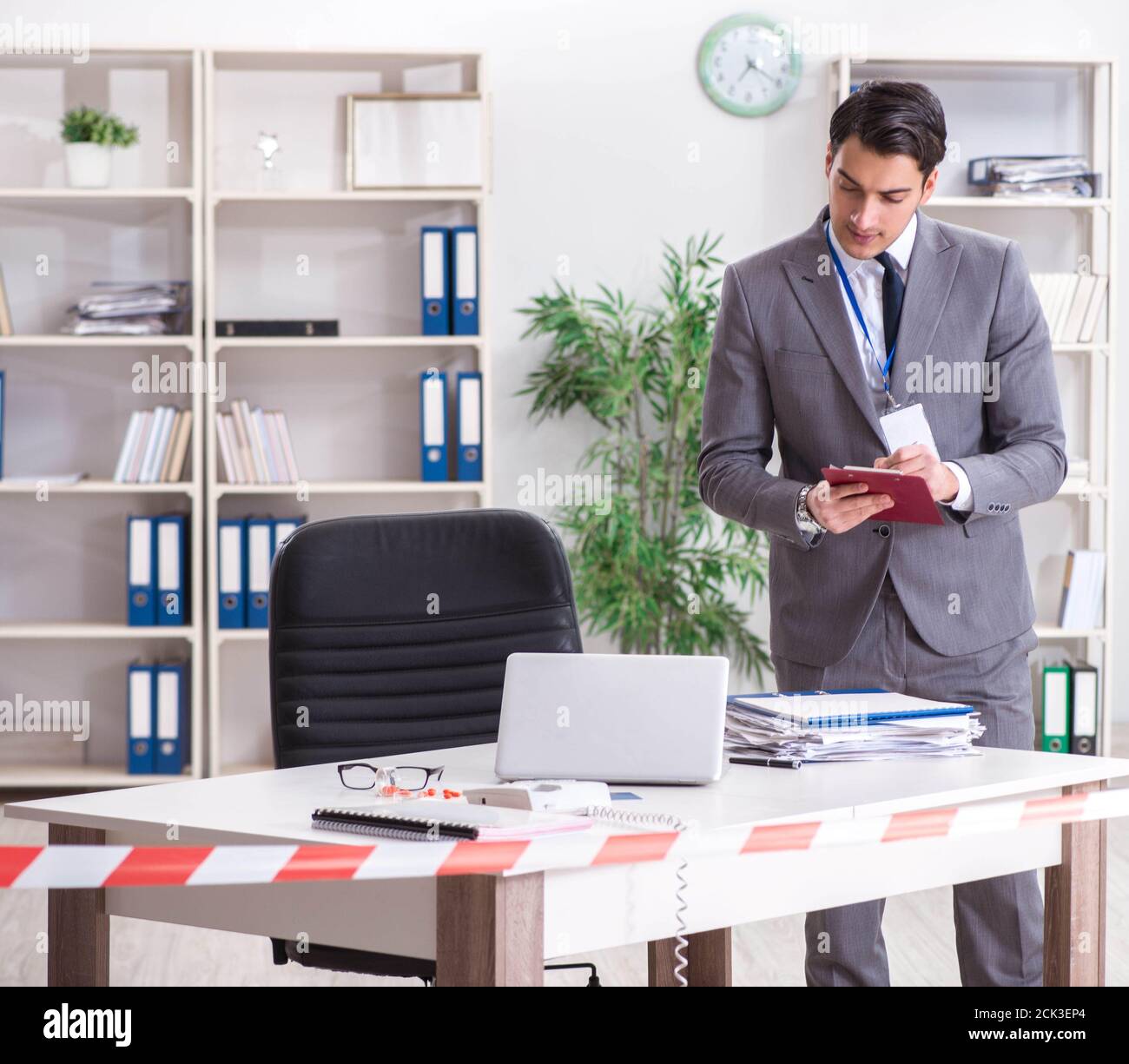 The forensics investigator at the scene of office crime Stock Photo - Alamy